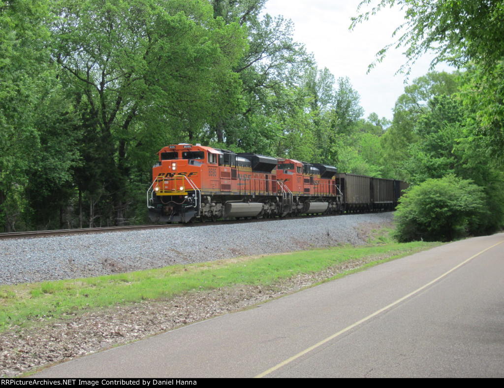 BNSF 8595 leads a wb empty coal train